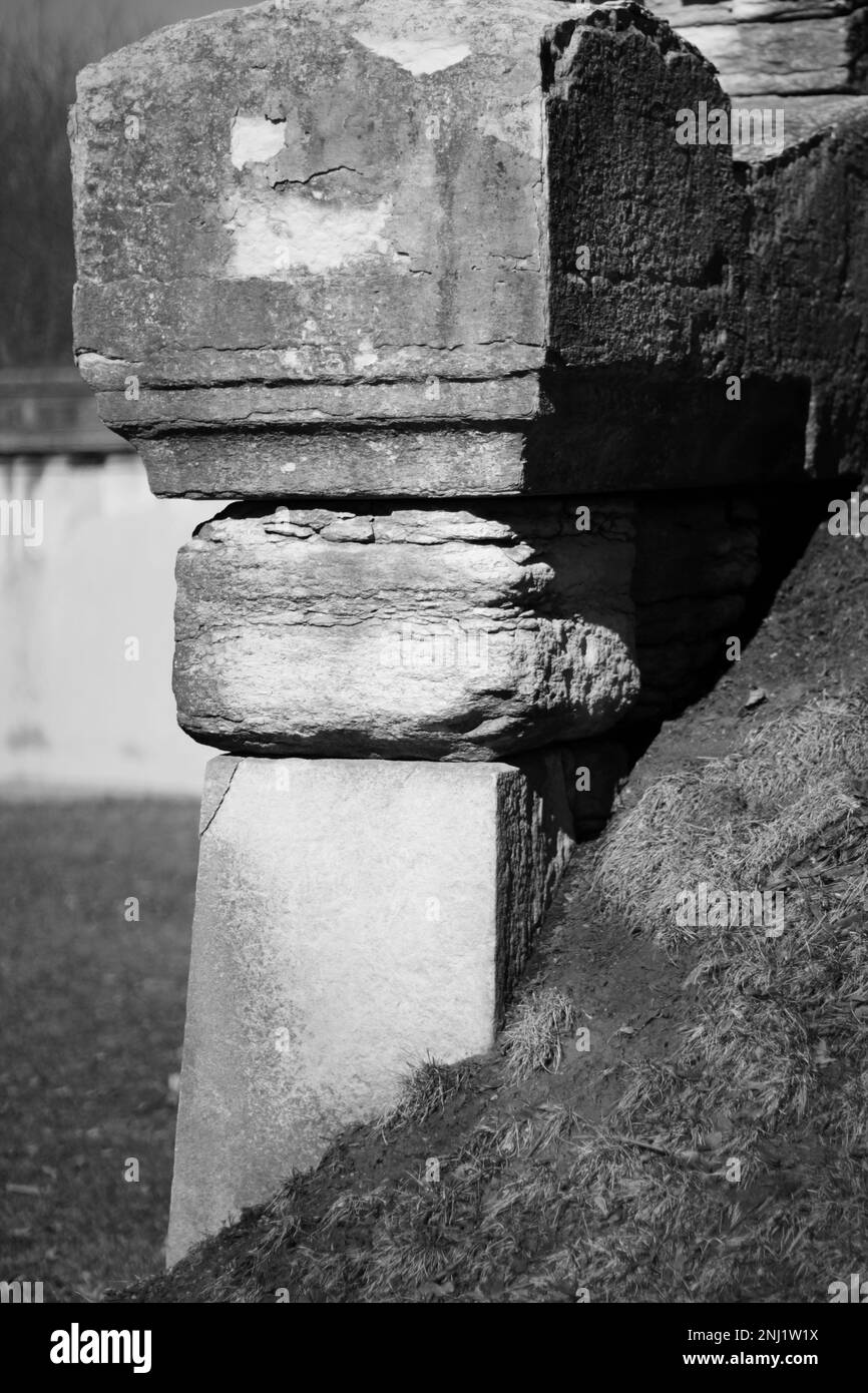 The column and building ruins of an old stone column barely standing in ...
