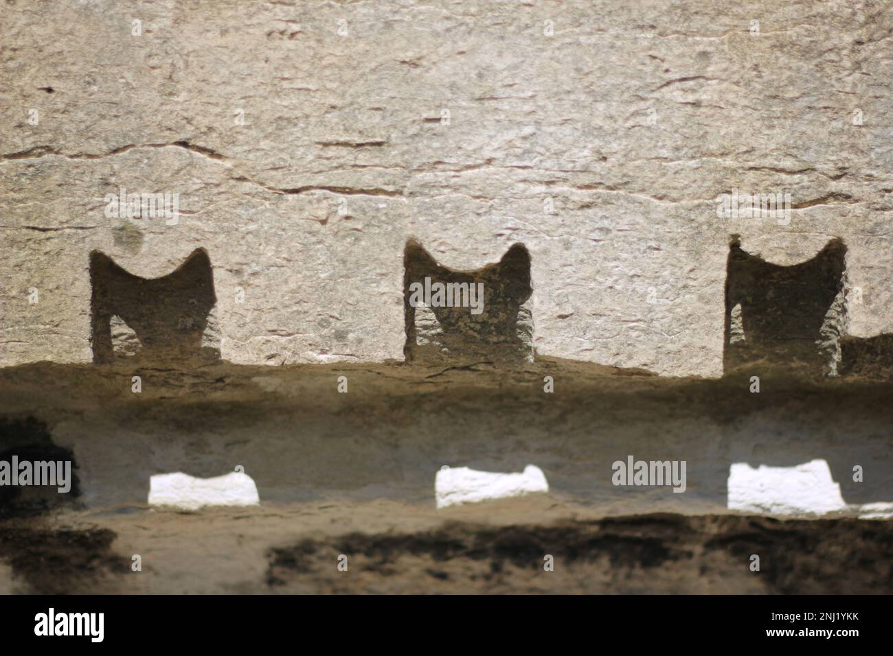 A natural stone wall with a repeating pattern as a decoration Stock ...