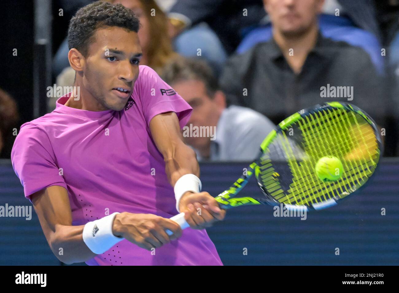 Canada's Felix Auger-Aliassime returns a ball to Switzerland's Marc-Andrea Huesler during their ...