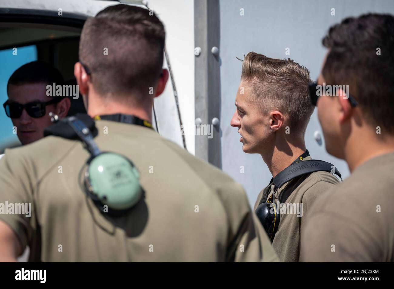 U.S. Airmen assigned to the 43d Fighter Generation Squadron communicate ...