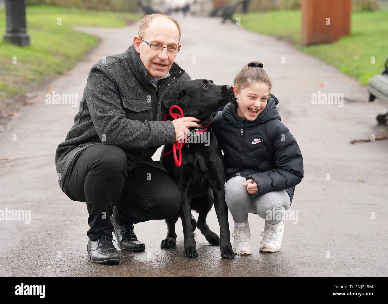 Wayne (left) and Lily Bellamy (right), 11, from Swansea, with Labrador ...