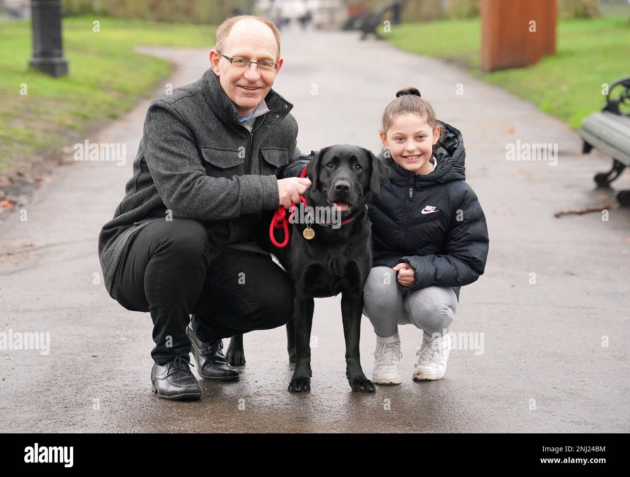 Wayne (left) and Lily Bellamy (right), 11, from Swansea, with Labrador ...