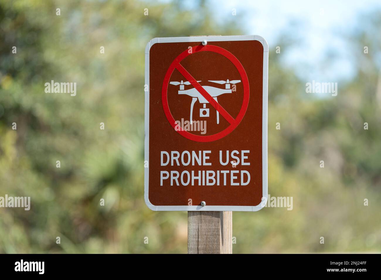 Signpost with warning about drone usage prohibition in state park ...