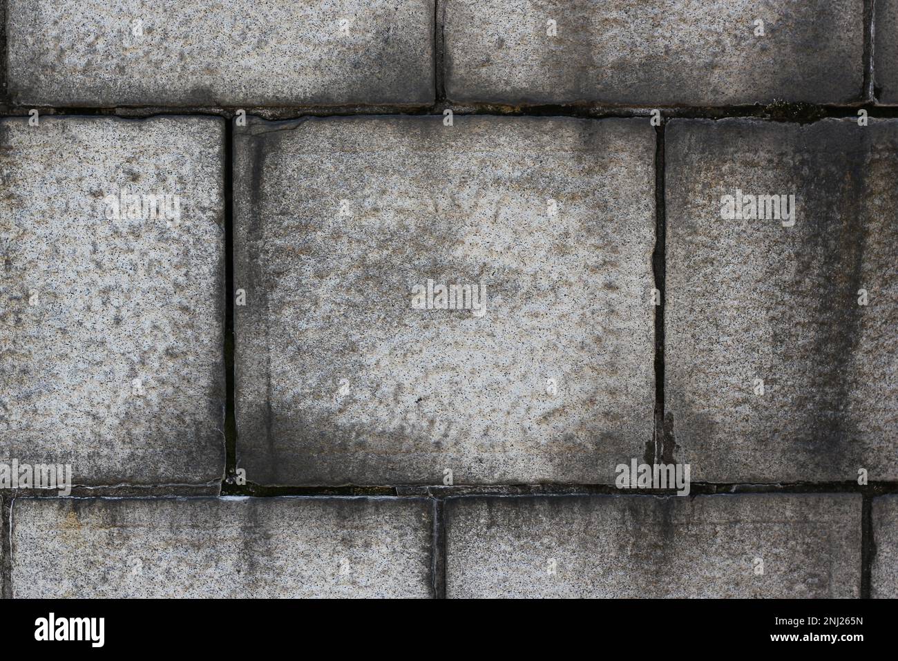 A solid stone wall made with huge blocks of stone Stock Photo - Alamy