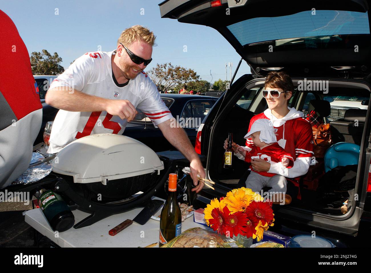 Jeremy Hulse (left) grilling shrimp, carne asada, and red and yellow ...
