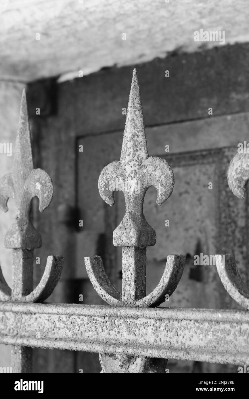 A closeup of a pointy and sharp decoration on an old medieval fence in ...