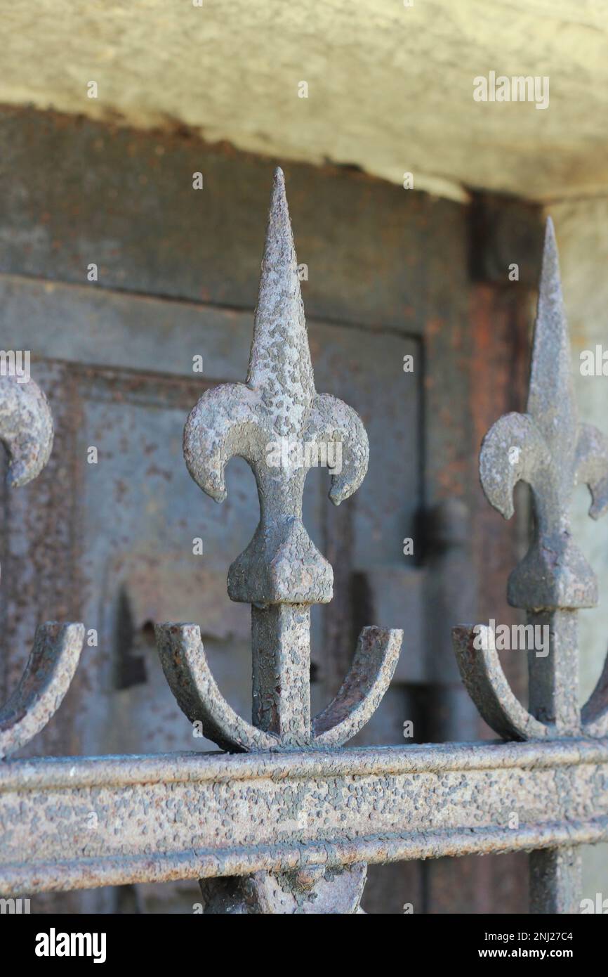 A closeup of a pointy and sharp decoration on an old medieval fence ...