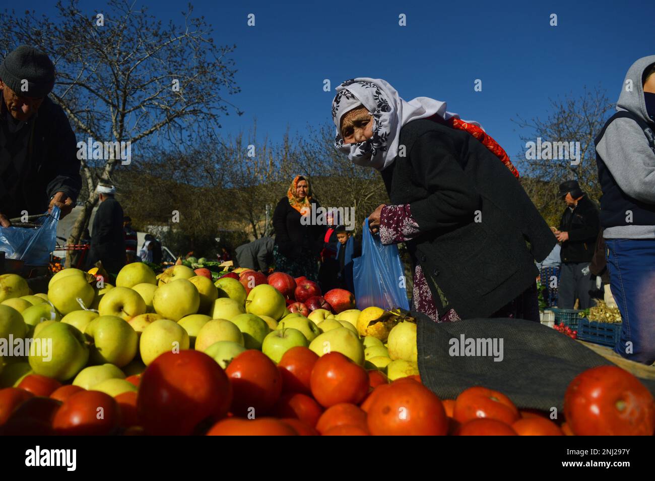 HATAY, SAMANDAG - TURKEY - 2 JANURAY: An old Uzbek woman is shopping in ...