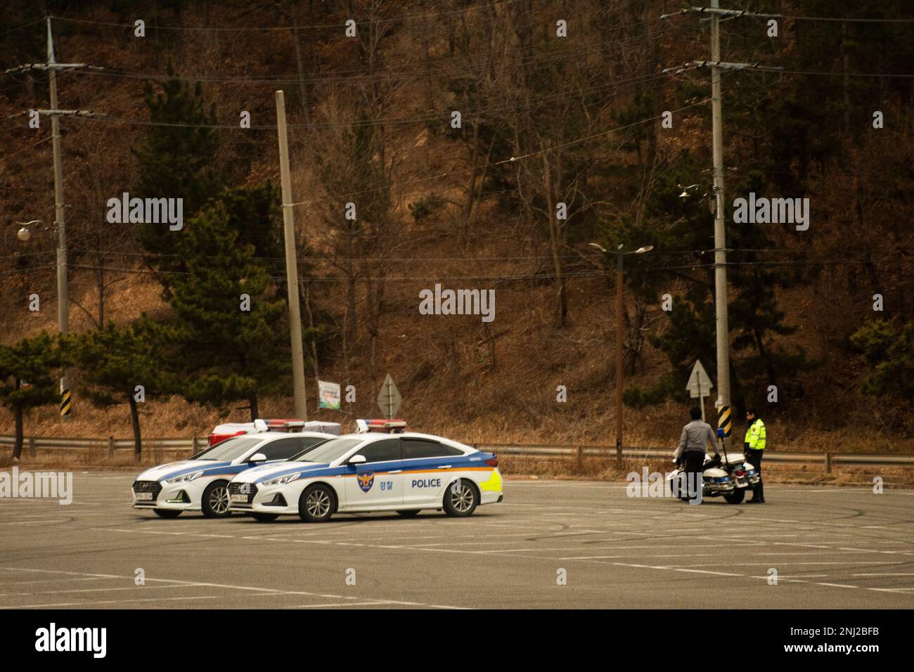Police men stand and stop vehicle for checking security guard and ...