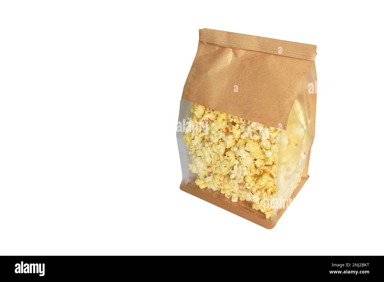 salty popcorn in brown paper packaging bag on white background Stock ...