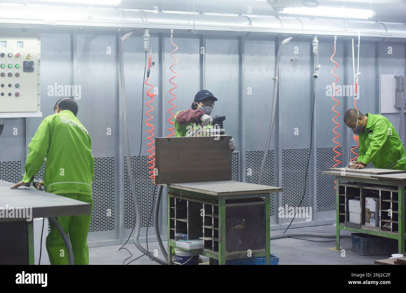 Workers, wearing masks for protection in the powder dust pollution ...