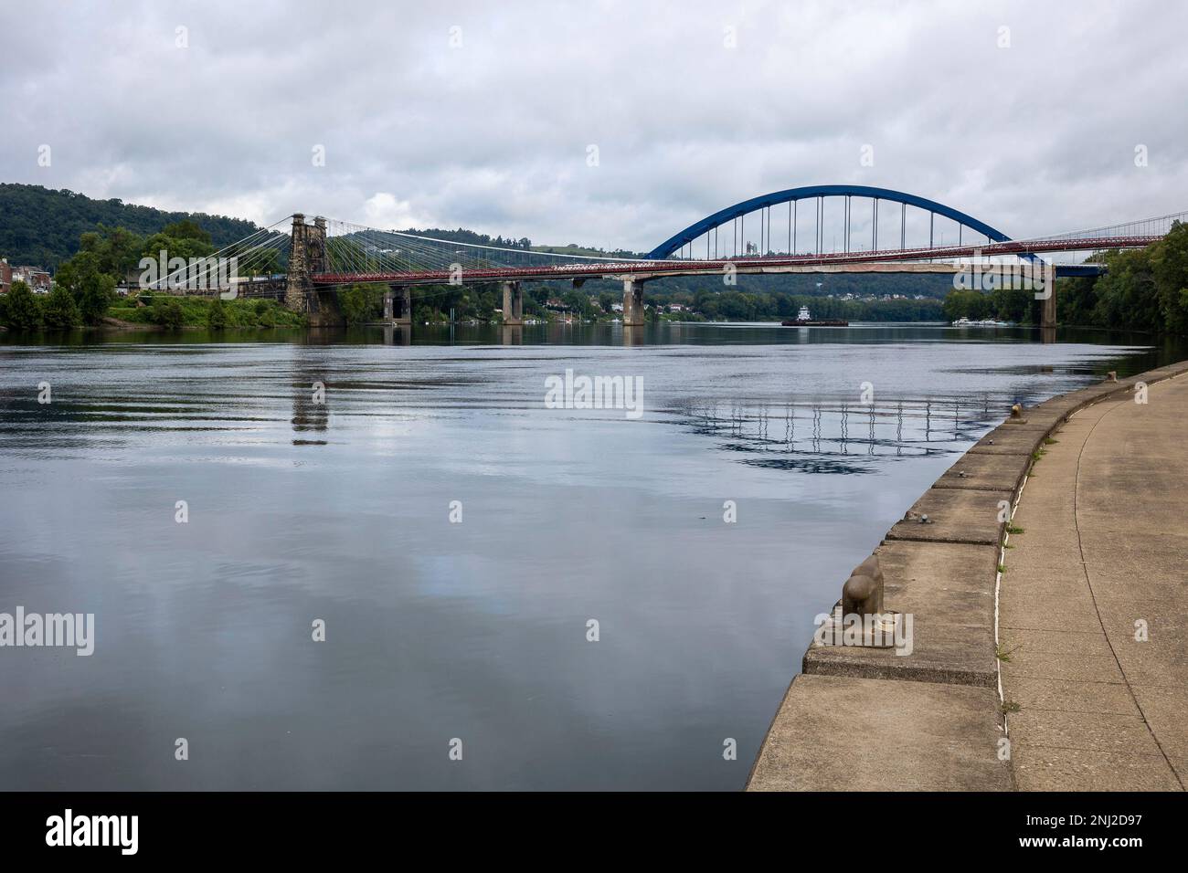 The Ohio River, spanned by the Wheeling Suspension Bridge and Fort ...