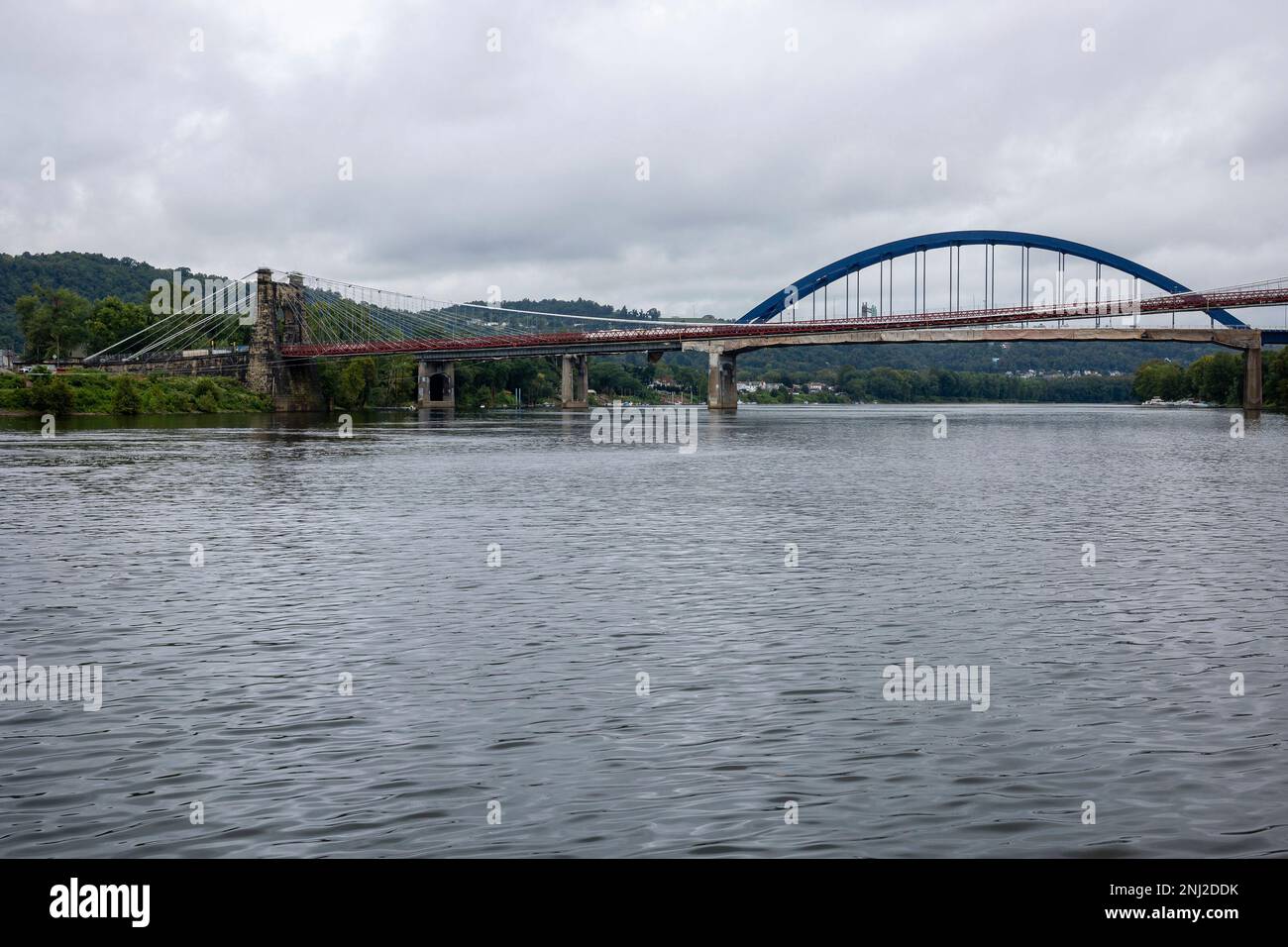 The Ohio River, spanned by the Wheeling Suspension Bridge and Fort ...
