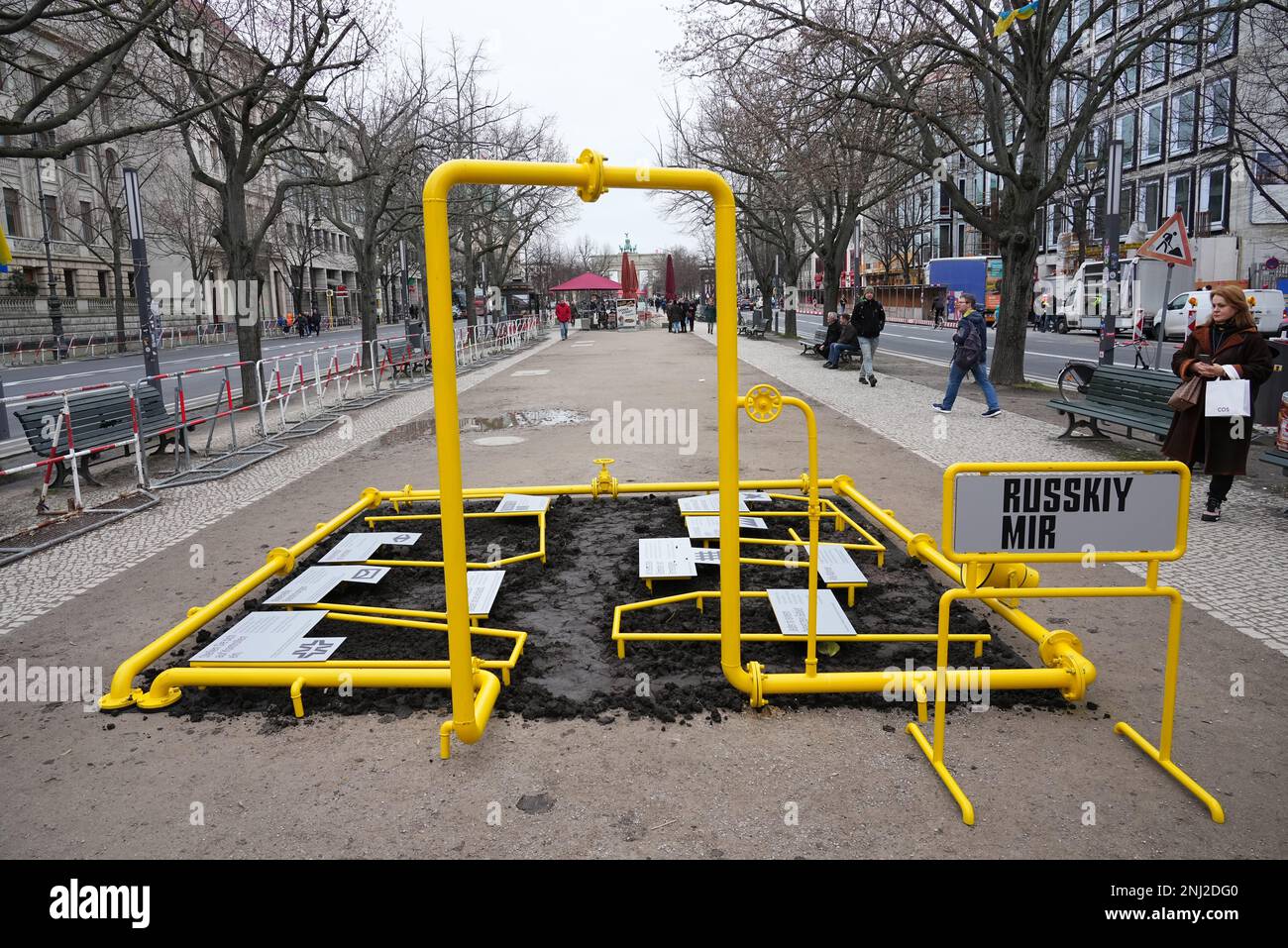 Berlin, Germany. 22nd Feb, 2023. A young woman walks by during the ...