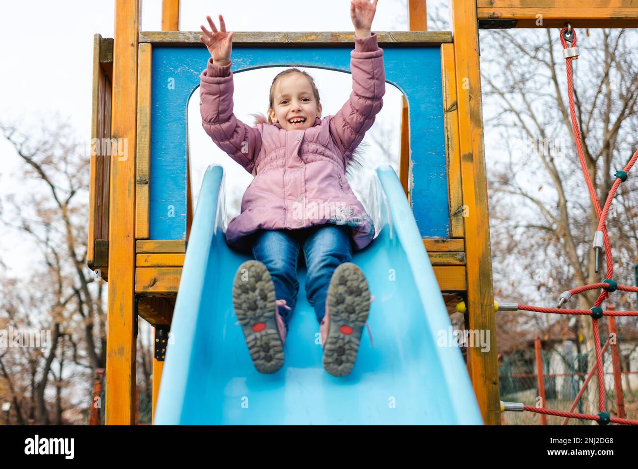 Girl child park playground slide hi-res stock photography and images ...