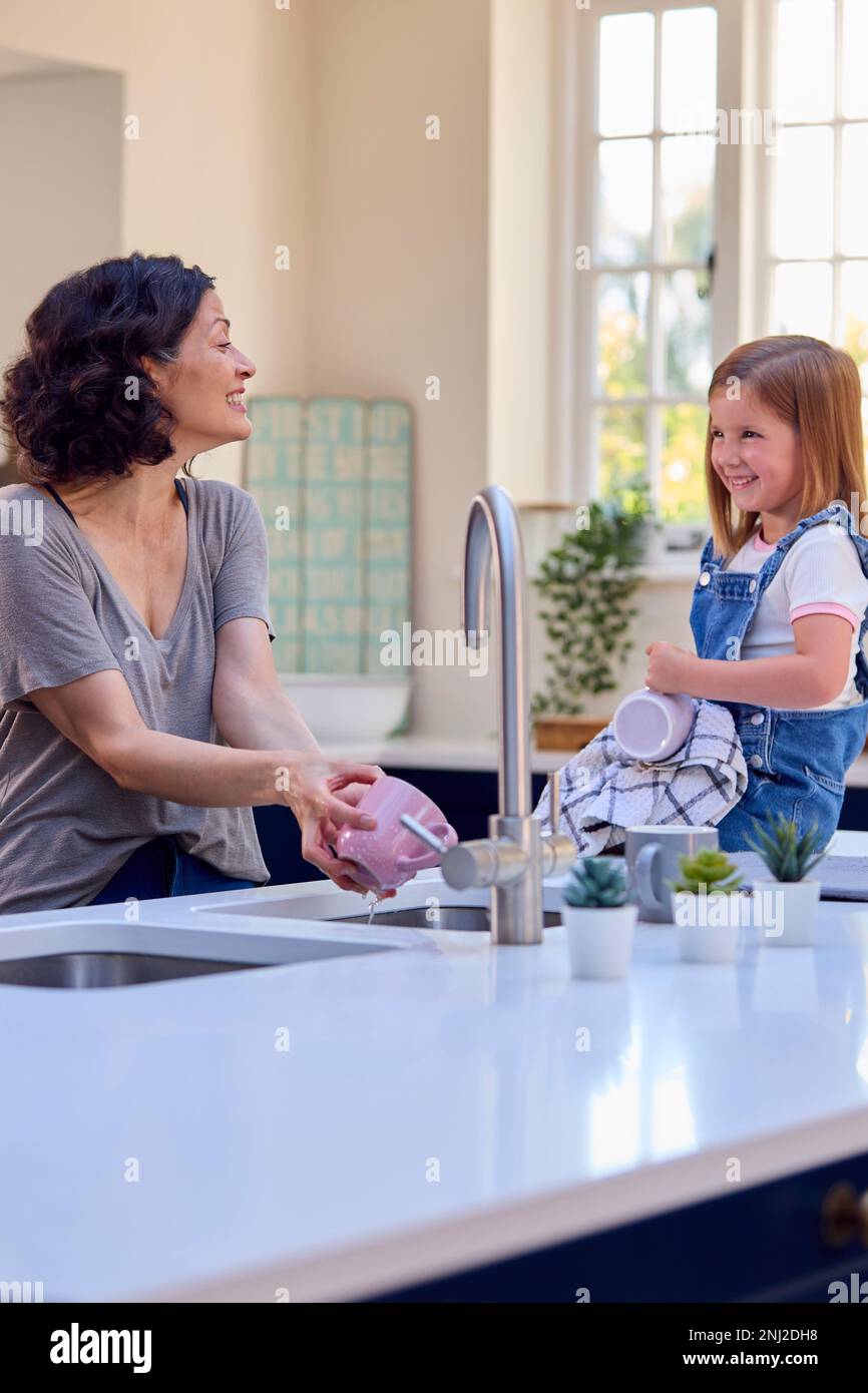 Child washing up at home hi-res stock photography and images - Alamy