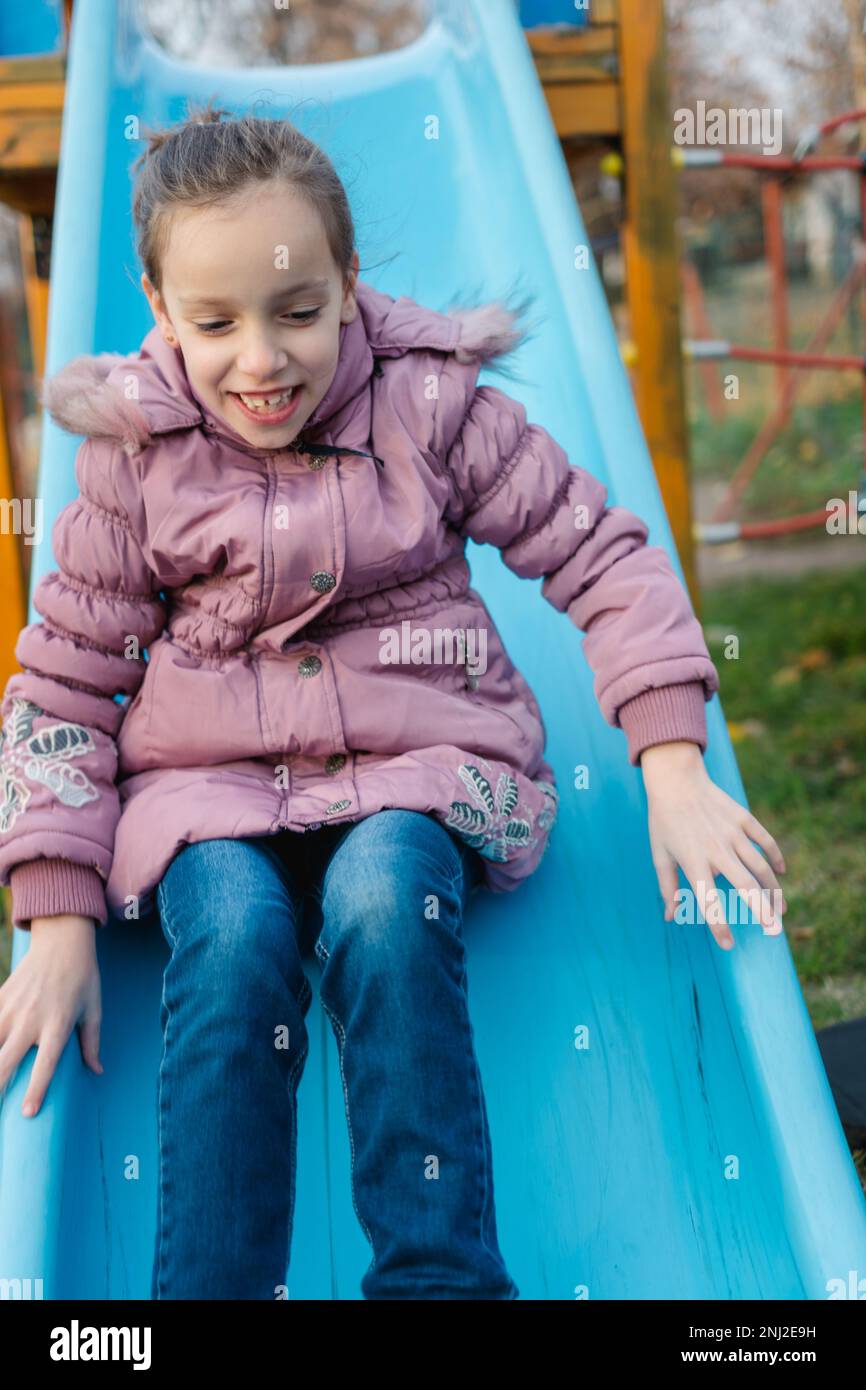 Girl child park playground slide hi-res stock photography and images ...