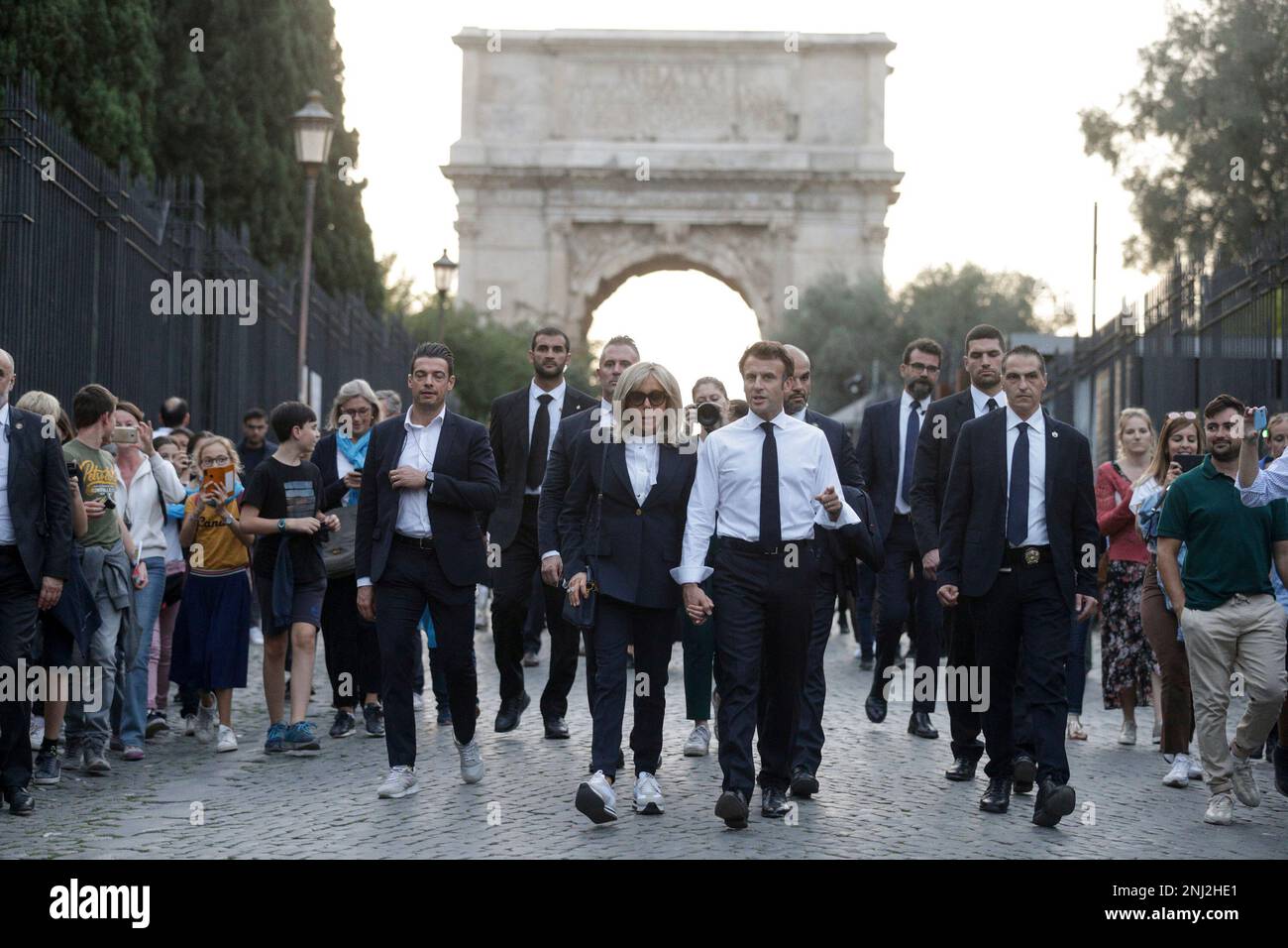French President Emmanuel Macron, center, and his wife Birgitte walk in ...