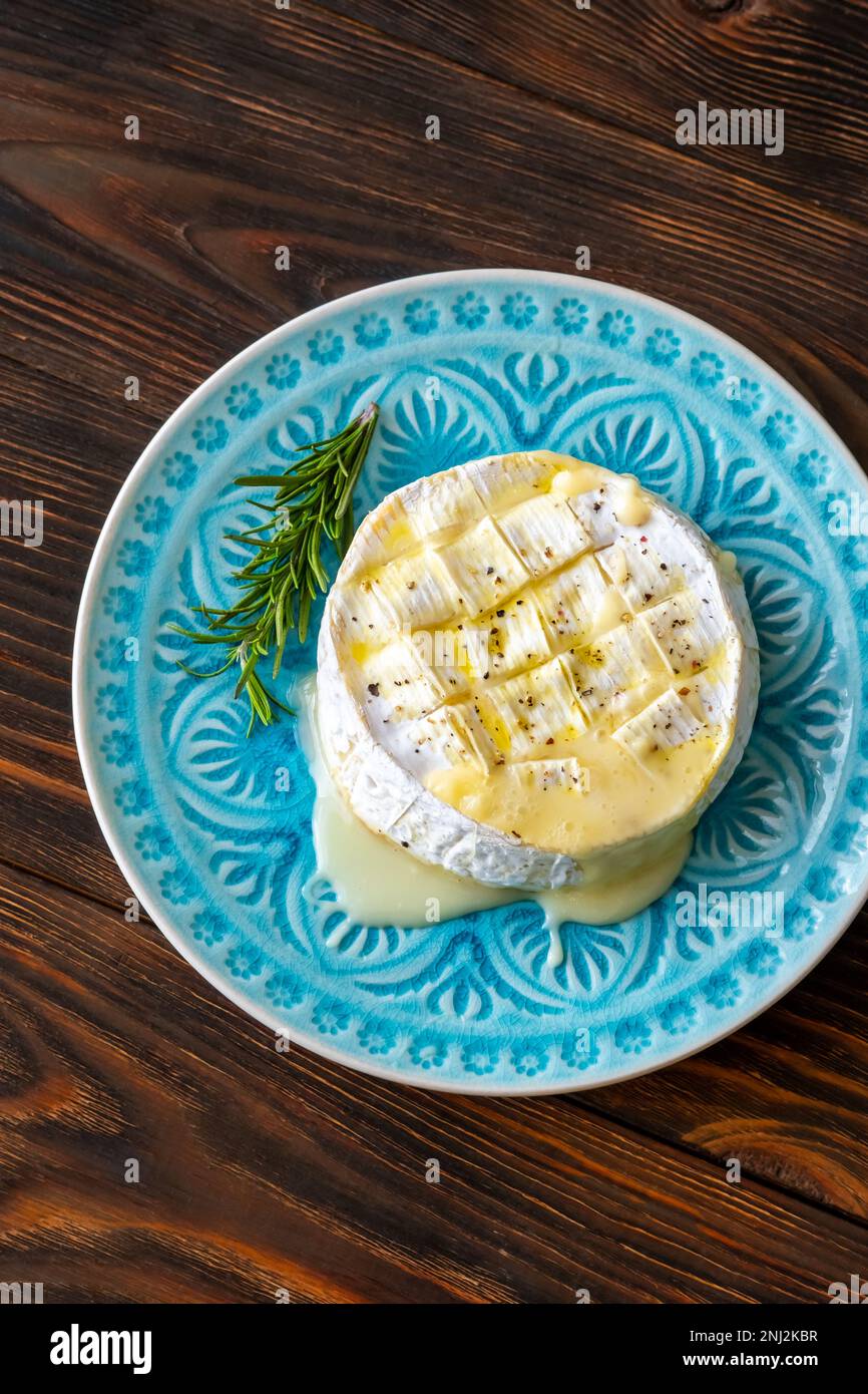 Baked Camembert cheese on the serving plate Stock Photo - Alamy