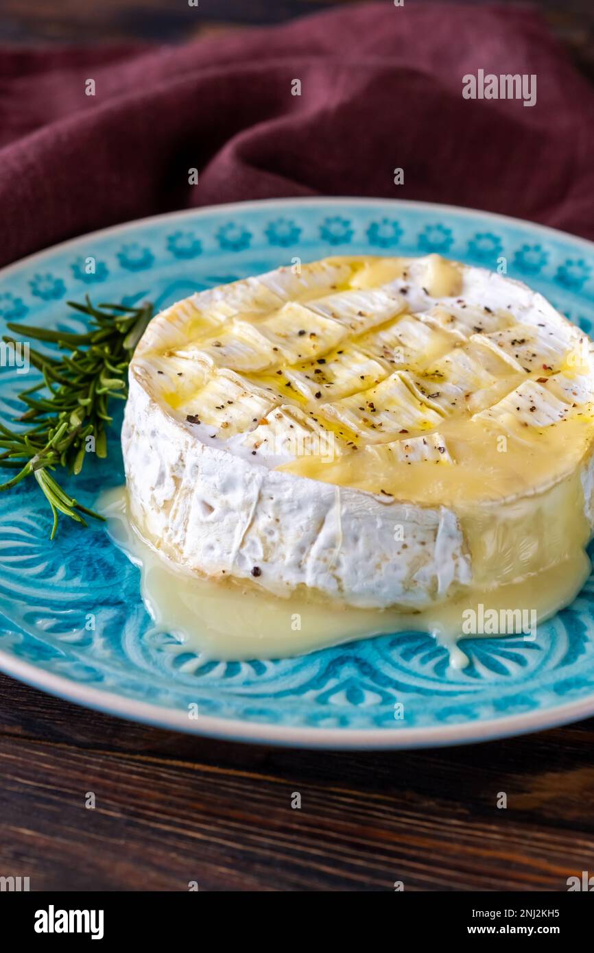 Baked Camembert cheese on the serving plate Stock Photo - Alamy