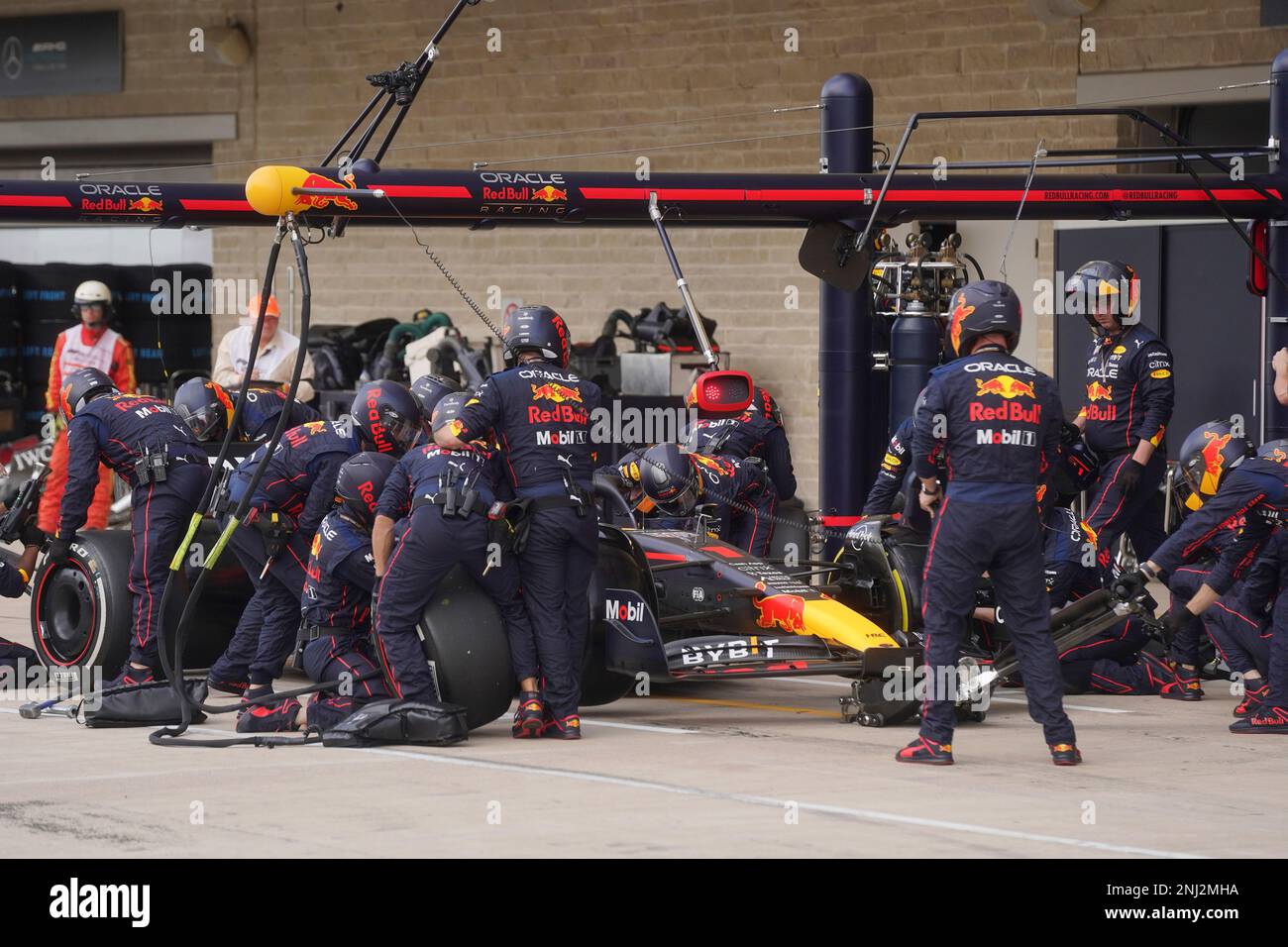 Team members perform a pit stop on the car of Red Bull driver Max ...