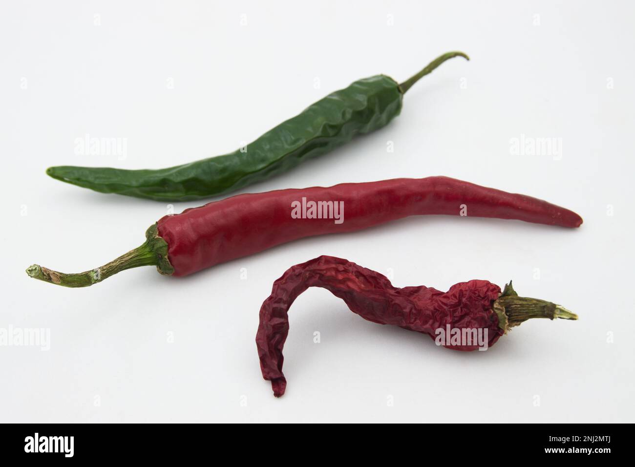Image of three peppers or chilli peppers (capsicum) in different states ...