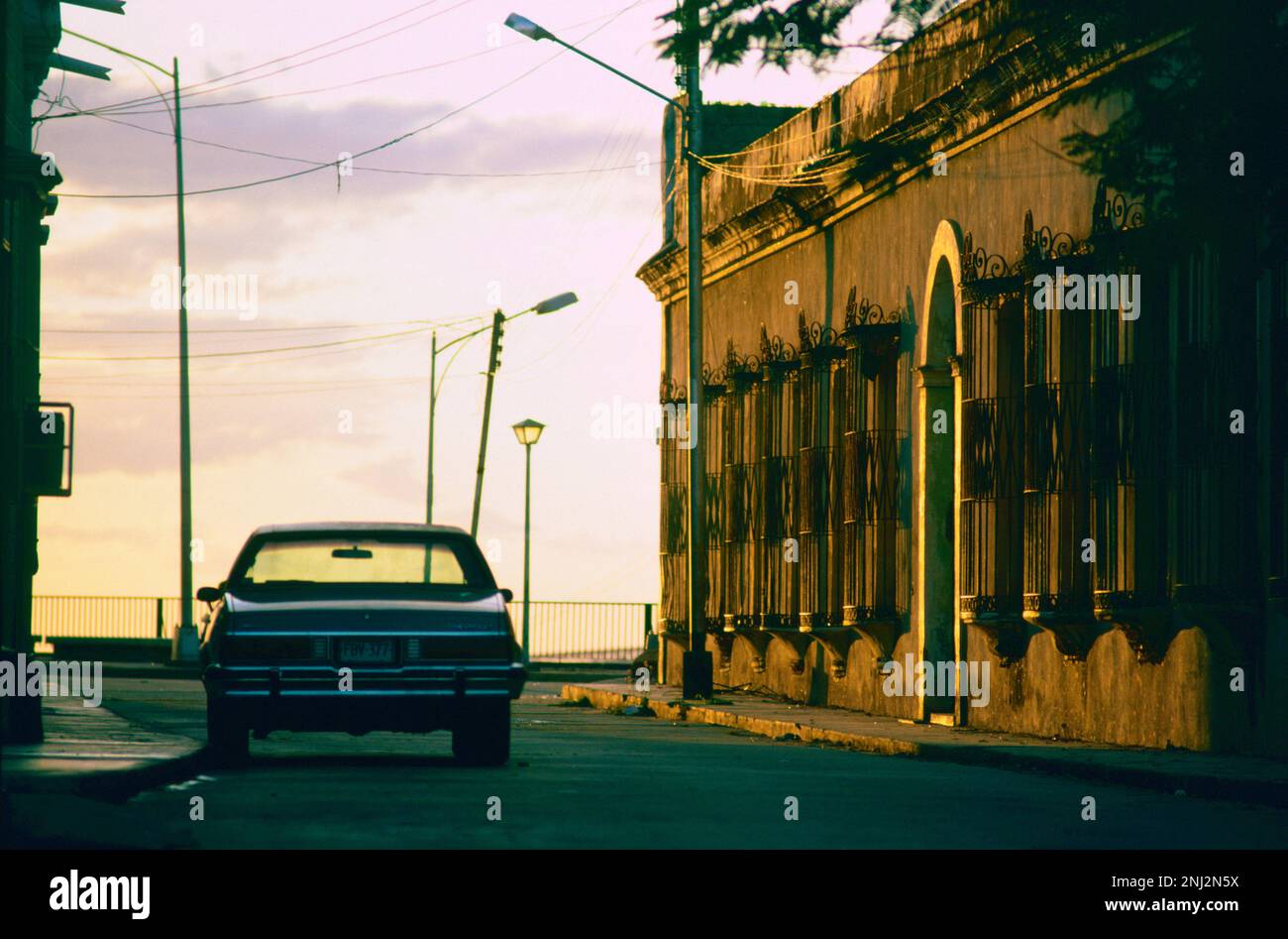 Car in street, sunset, Ciudad Bolivar, Venezuela Stock Photo - Alamy