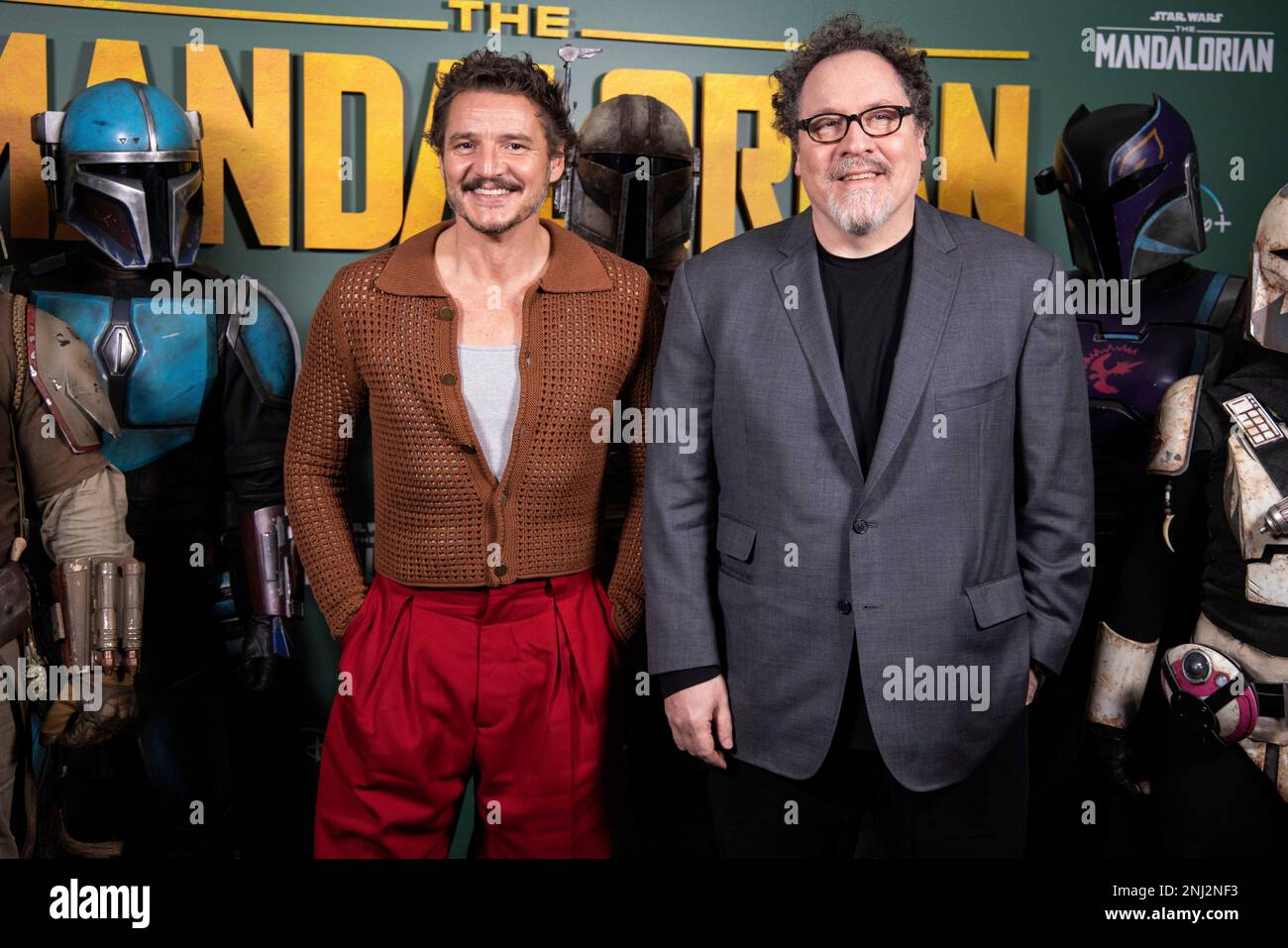 Pedro Pascal, left, and Jon Favreau pose for photographers during a ...