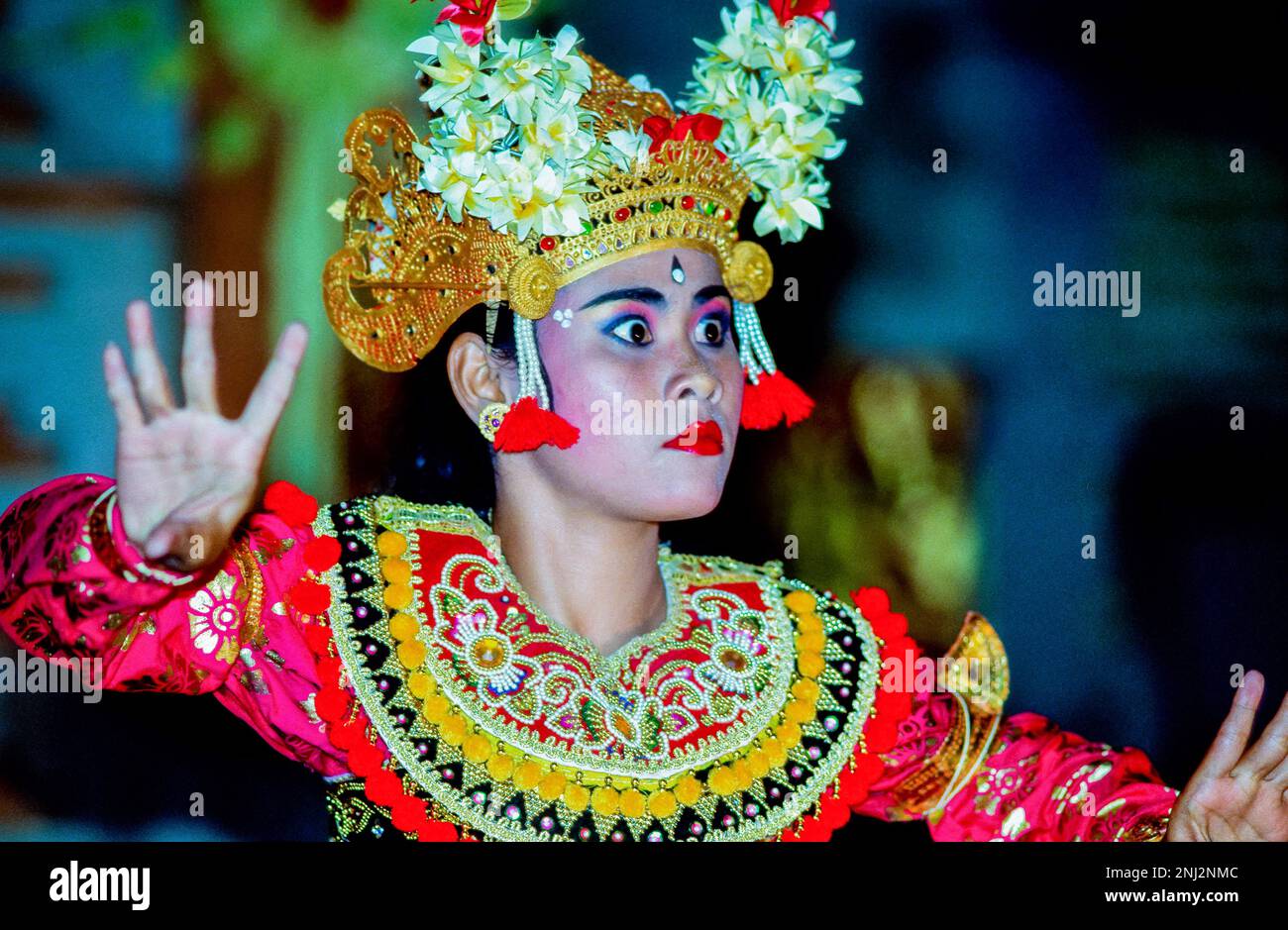 Indonesia, Ubud, Bali. Woman performing a traditional Legong dance in a ...