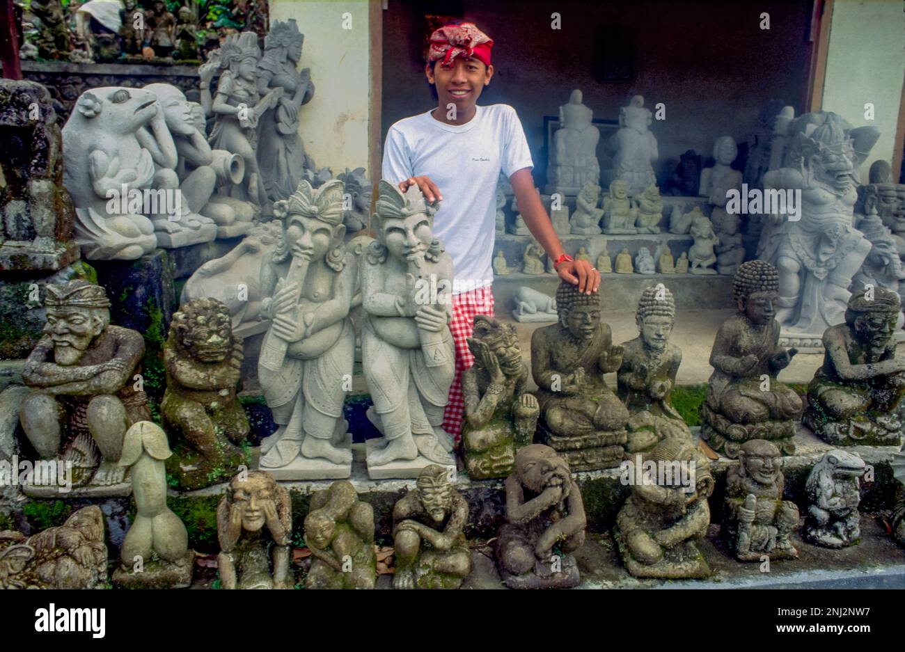 Indonesia, Ubud. Man selling sculptures that symbolize fertility Stock ...