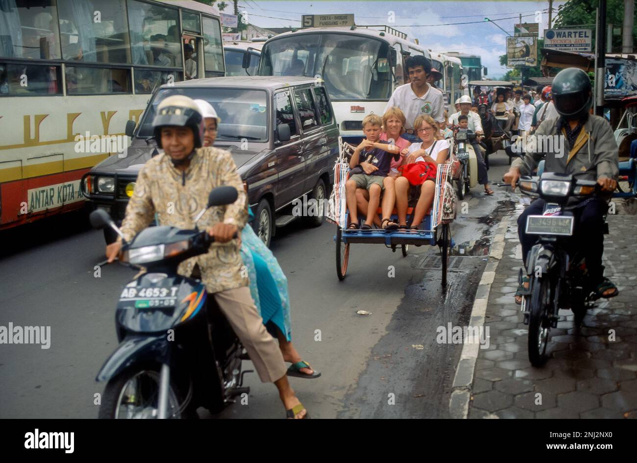 Indonesia, Yogyakarta. Western family in a rickshaw Stock Photo - Alamy