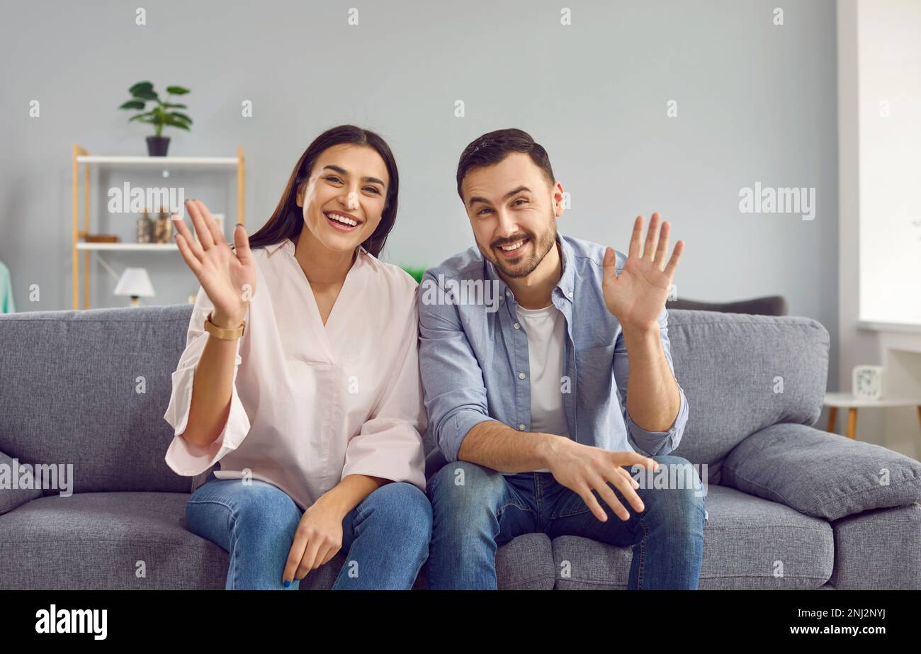Happy family waving hands camera hi-res stock photography and images ...