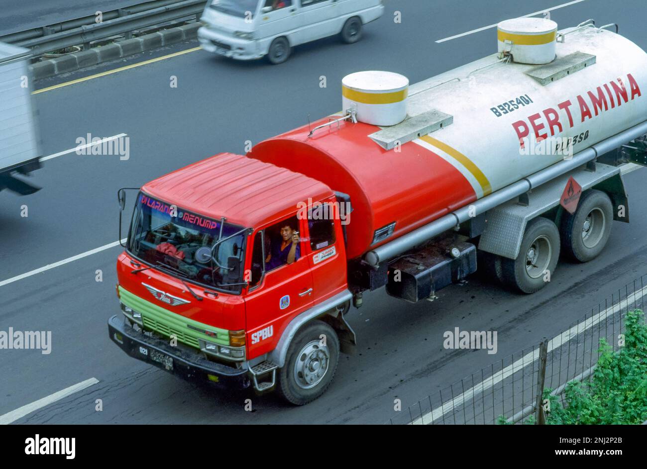 Indonesia, Jakarta. Truck transporting oil from Pertamina, an ...