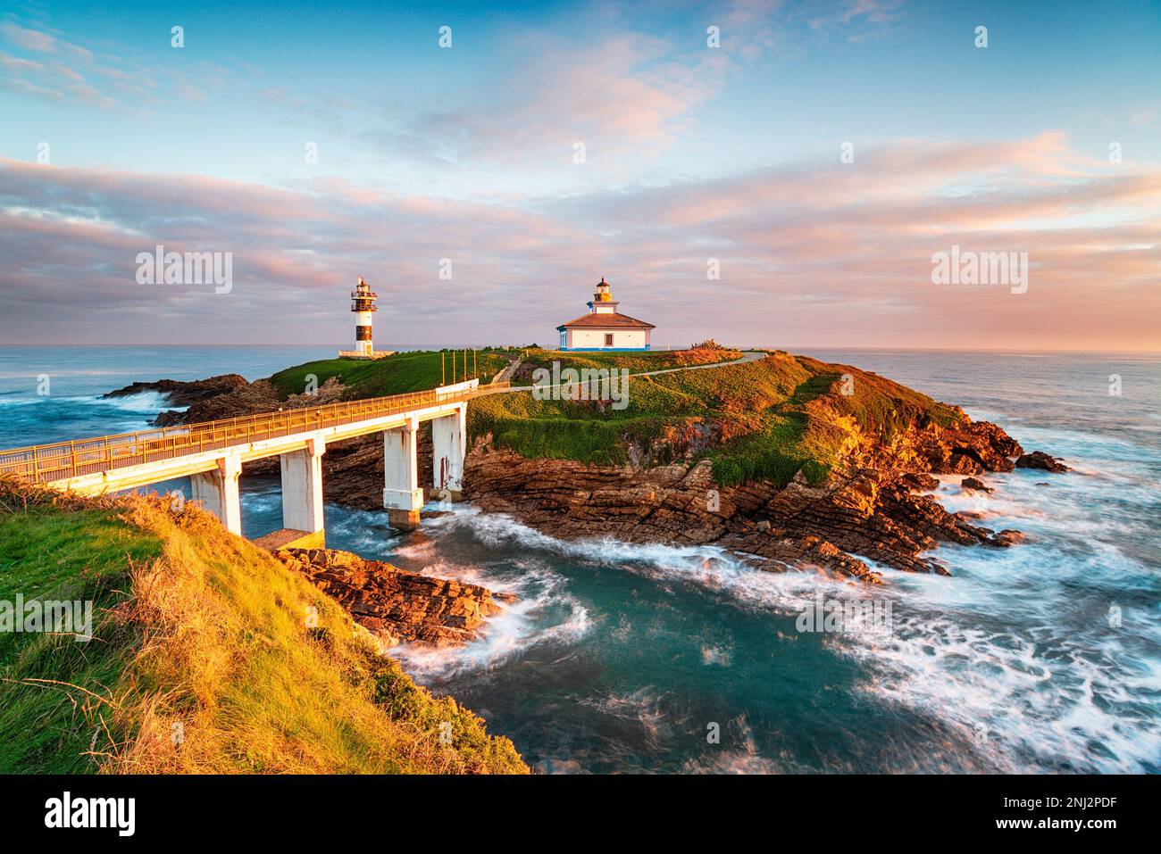 The beautiful Illa Pancha and it's lighthouse at Ribadeo on the north ...