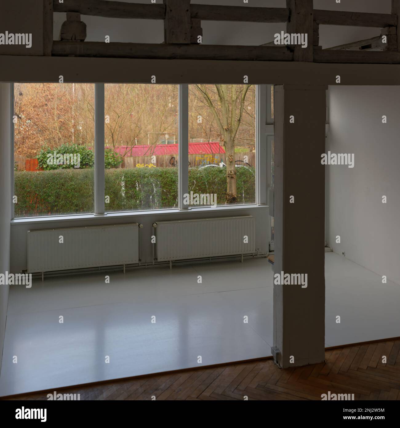 Empty artist studio with high white walls in Hanover Stock Photo - Alamy