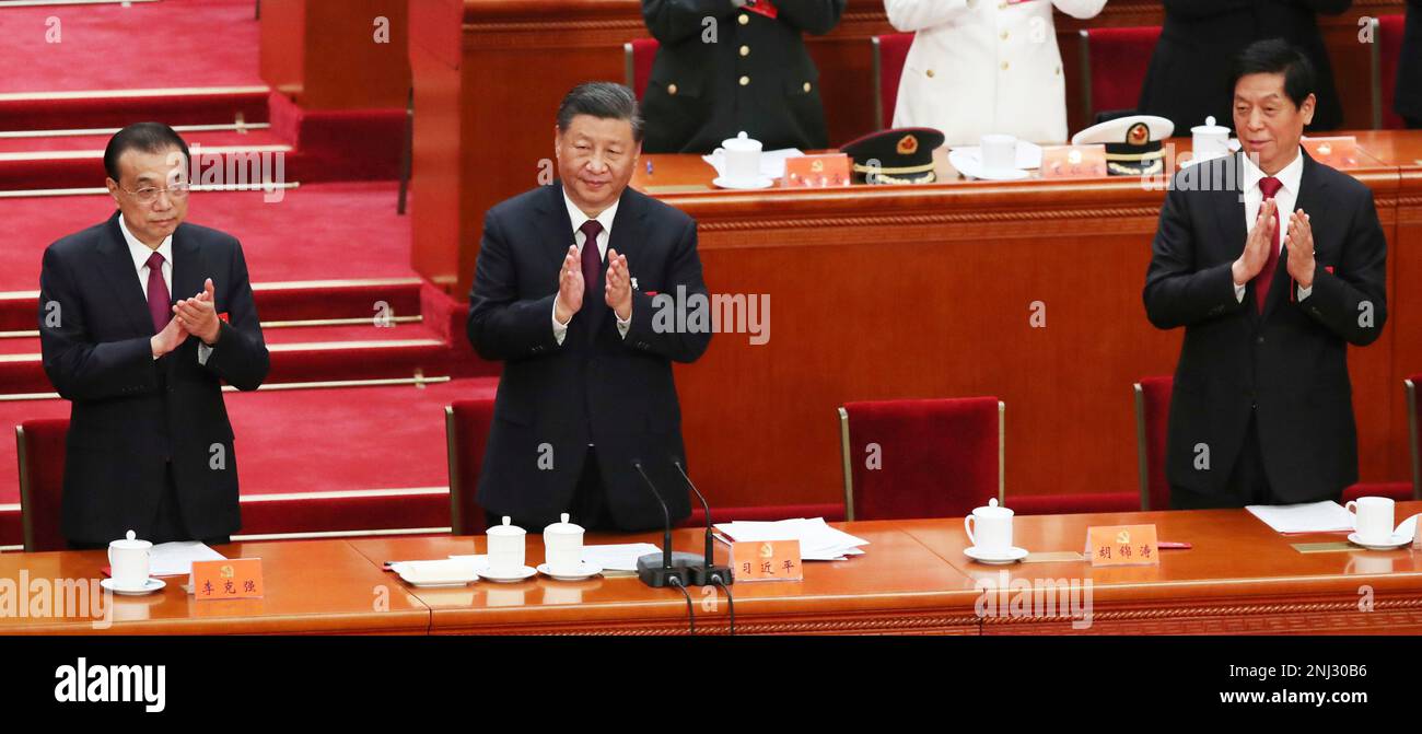 Chinese President Xi Jinping (C) claps his hands during the closing ...