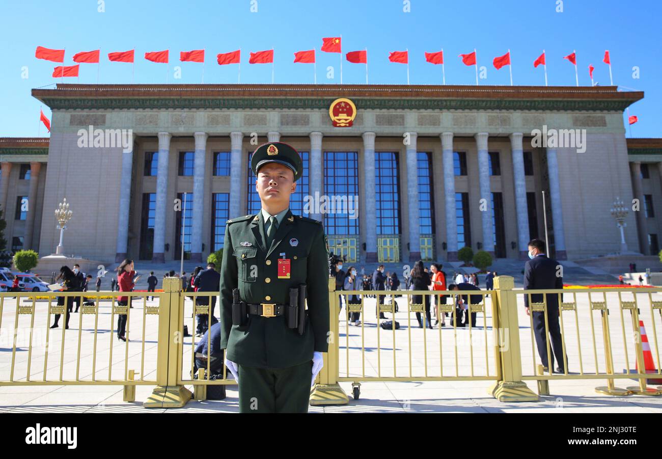 A police officer stands at the Great Hall of the People where the ...