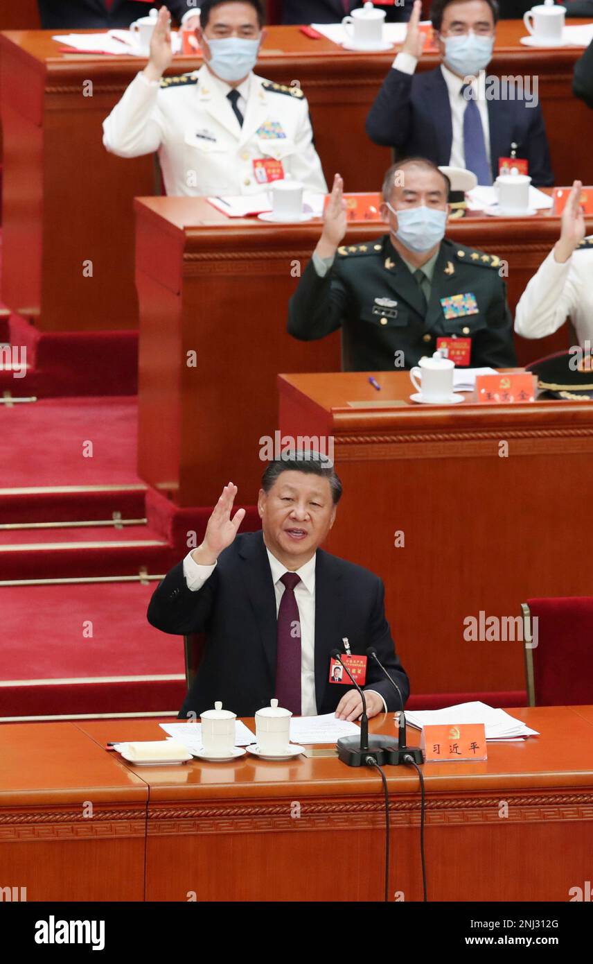 Chinese President Xi Jinping votes during the closing ceremony of the ...