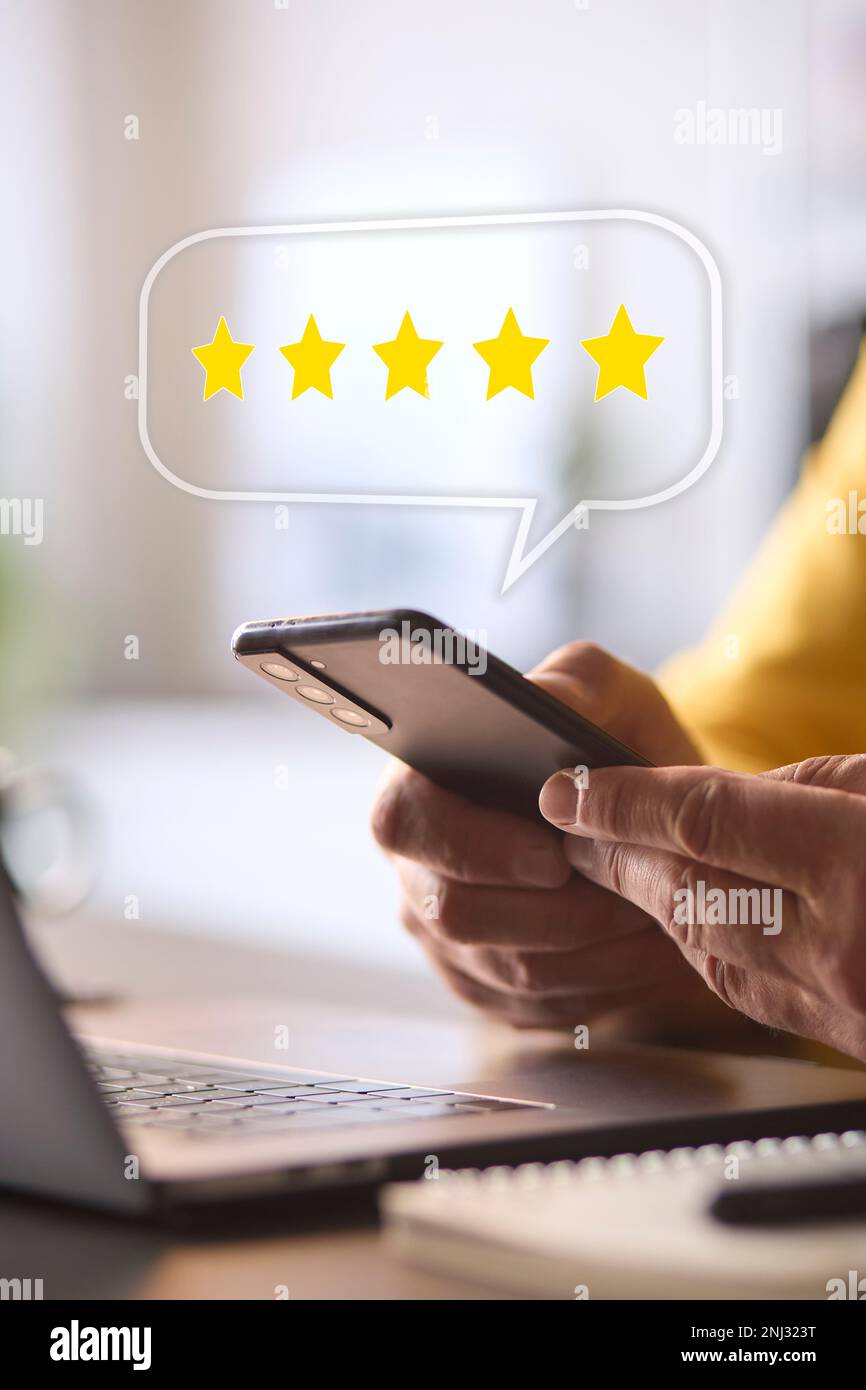 Man Using Mobile Phone With Graphic Overlay To Leave Positive 5 Star ...