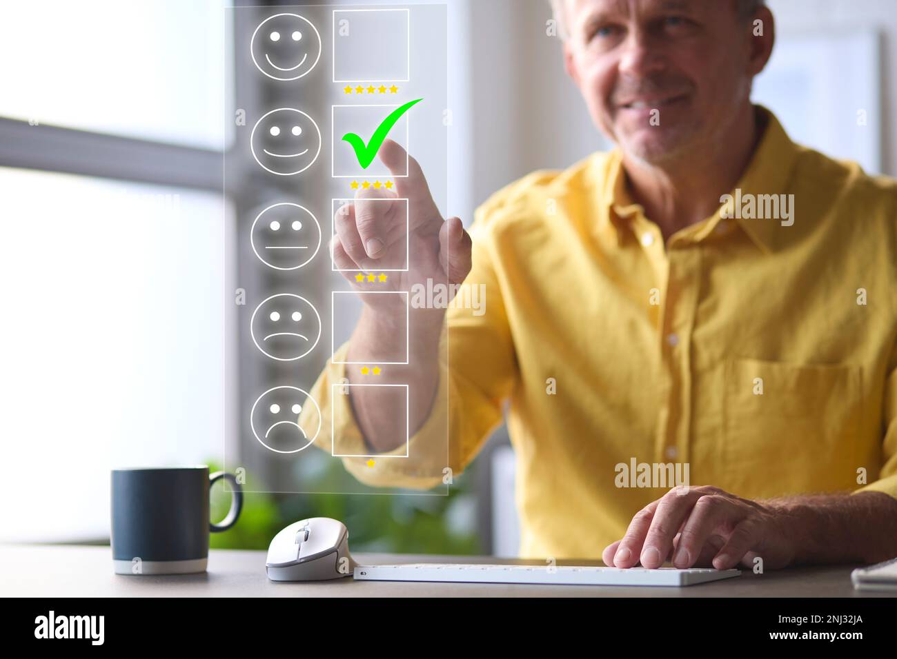 Man Using Computer With Graphic Overlay To Leave Positive Online Review ...