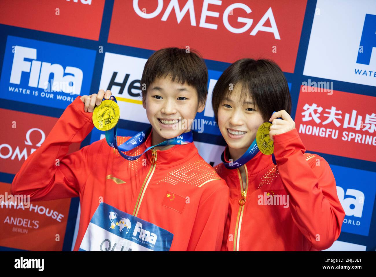 Hongchan Quan, left, and Yuxi Chen of China pose with their gold medalk ...