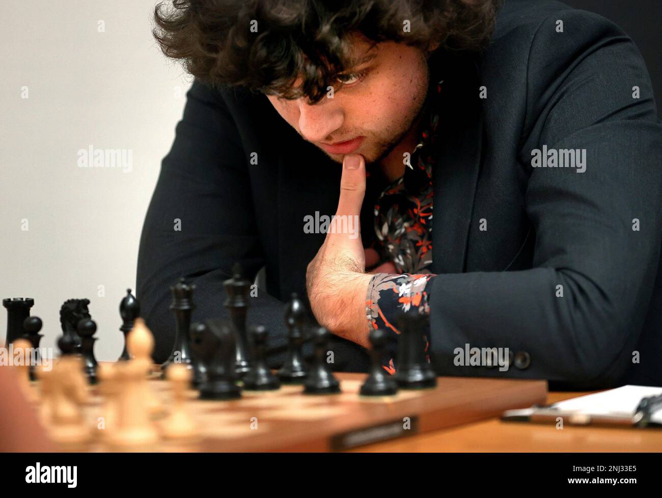 FILE - Chess Grandmaster Hans Niemann, 19, studies the board during a ...