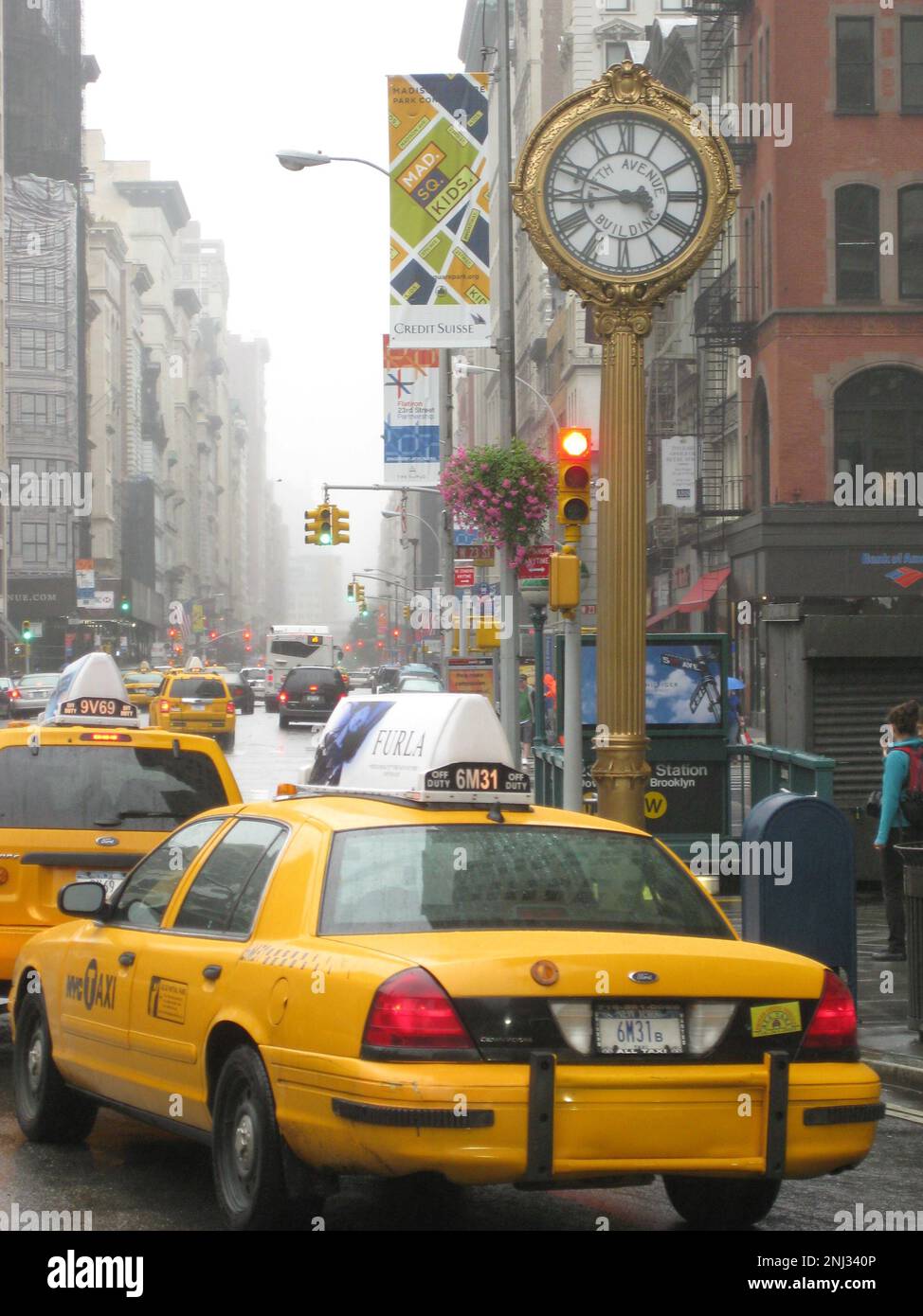 A typical yellow cab in downtown Manhattan of New York. These taxis are ...