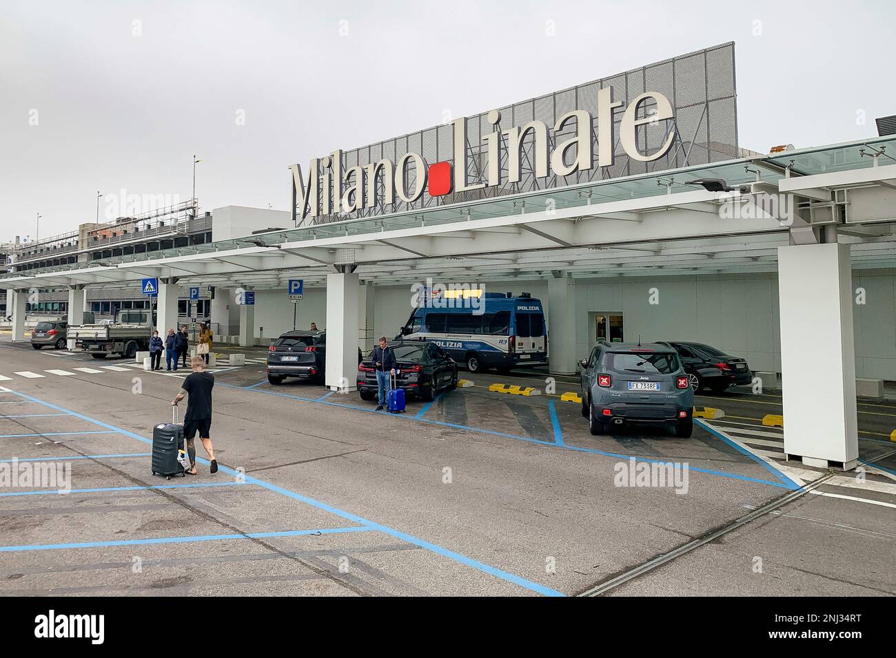 Passengers outside Milan Linate airport, Italy, as unions have called ...