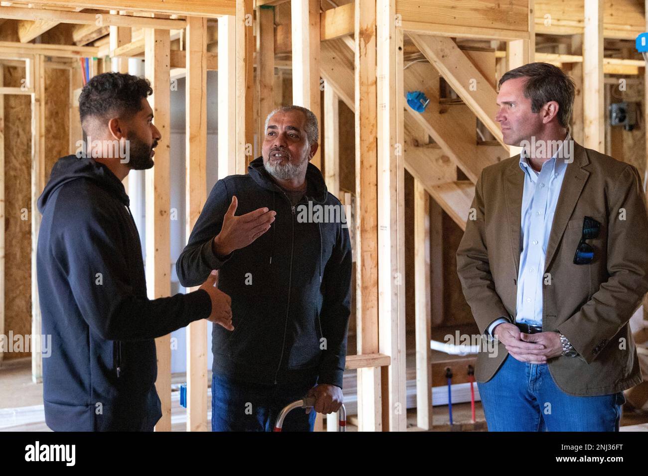 Kentucky Gov. Andy Beshear talks with Jalal Saleh and his son Ahmed ...