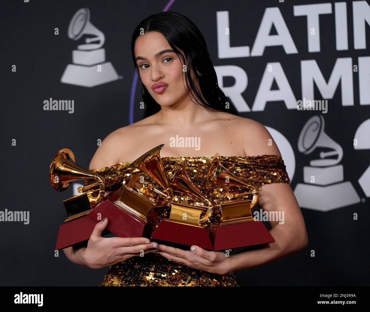FILE - Spanish artist Rosalia poses in the press room with the awards ...