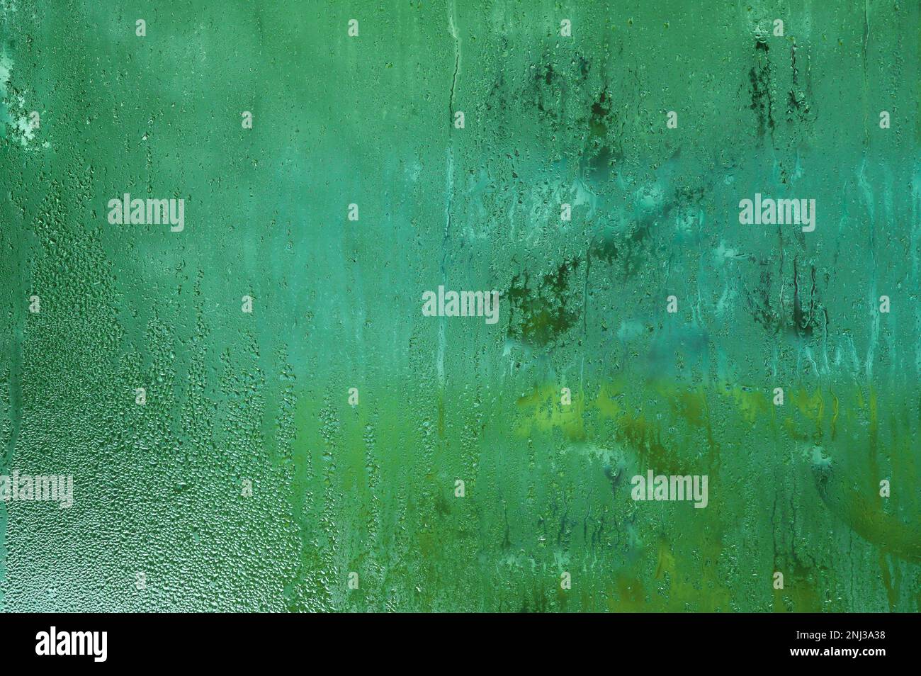 green background of wet glass. condensation on the window Stock Photo ...