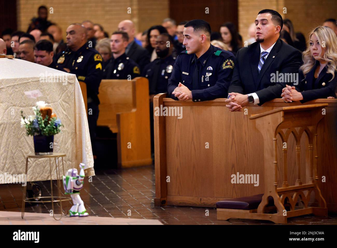 Dallas Police Officer Joshua Arellano, center, left, and his brother ...