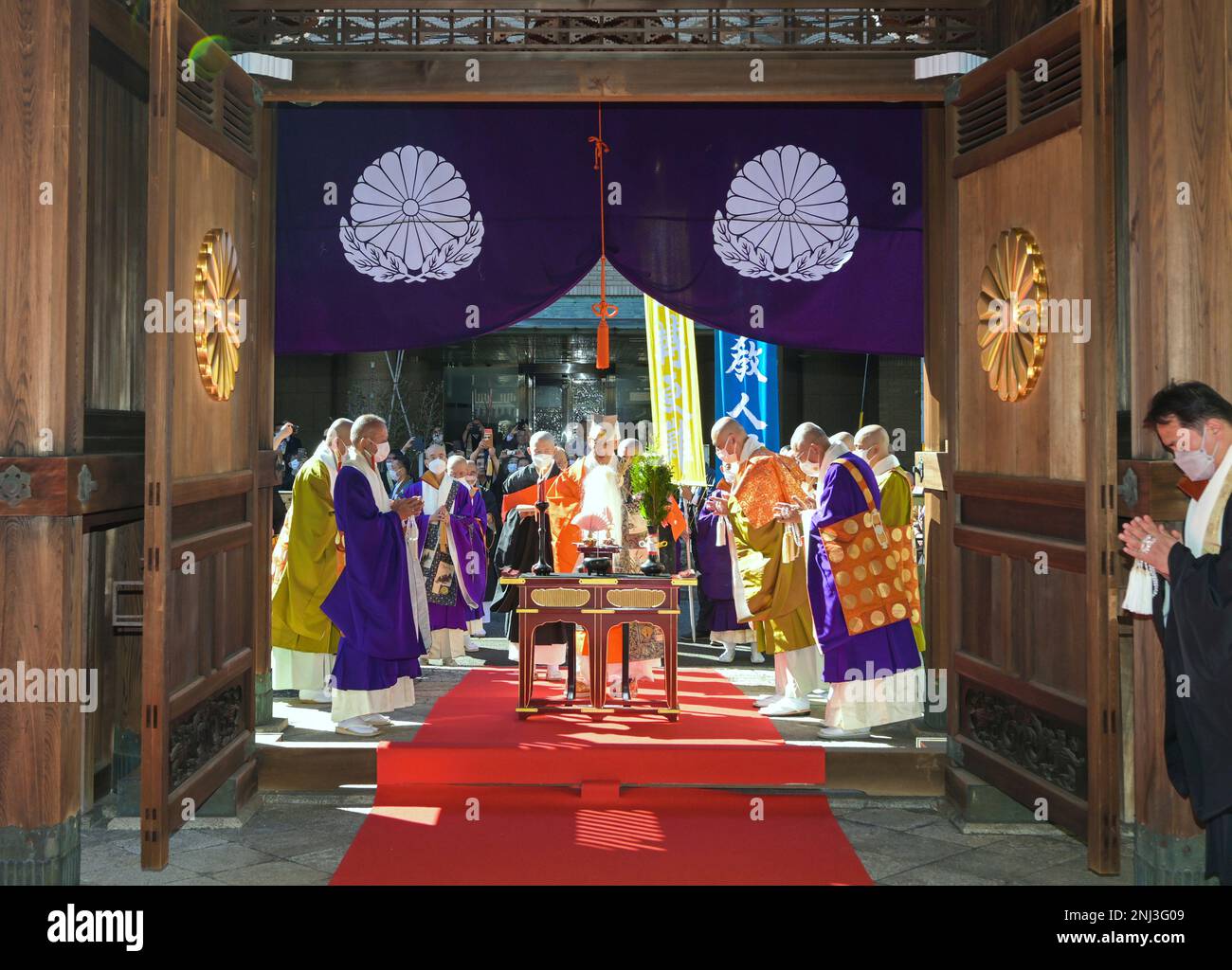 Jitsuo Iida (C), head of a Buddhist sect walks at Chokumon Gate of ...