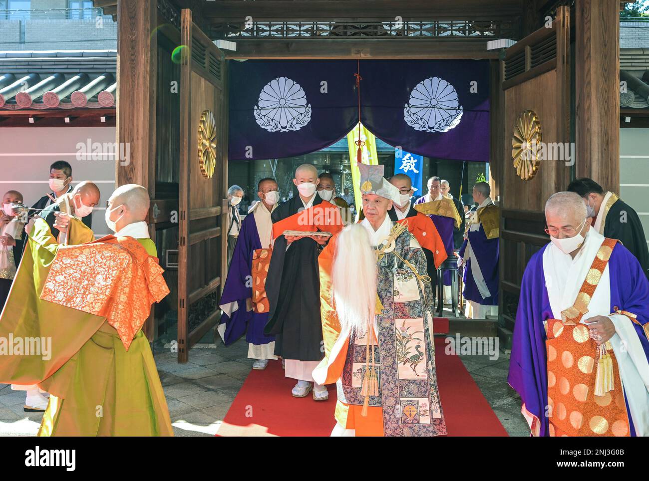 Jitsuo Iida (C), head of a Buddhist sect walks at Chokumon Gate of ...